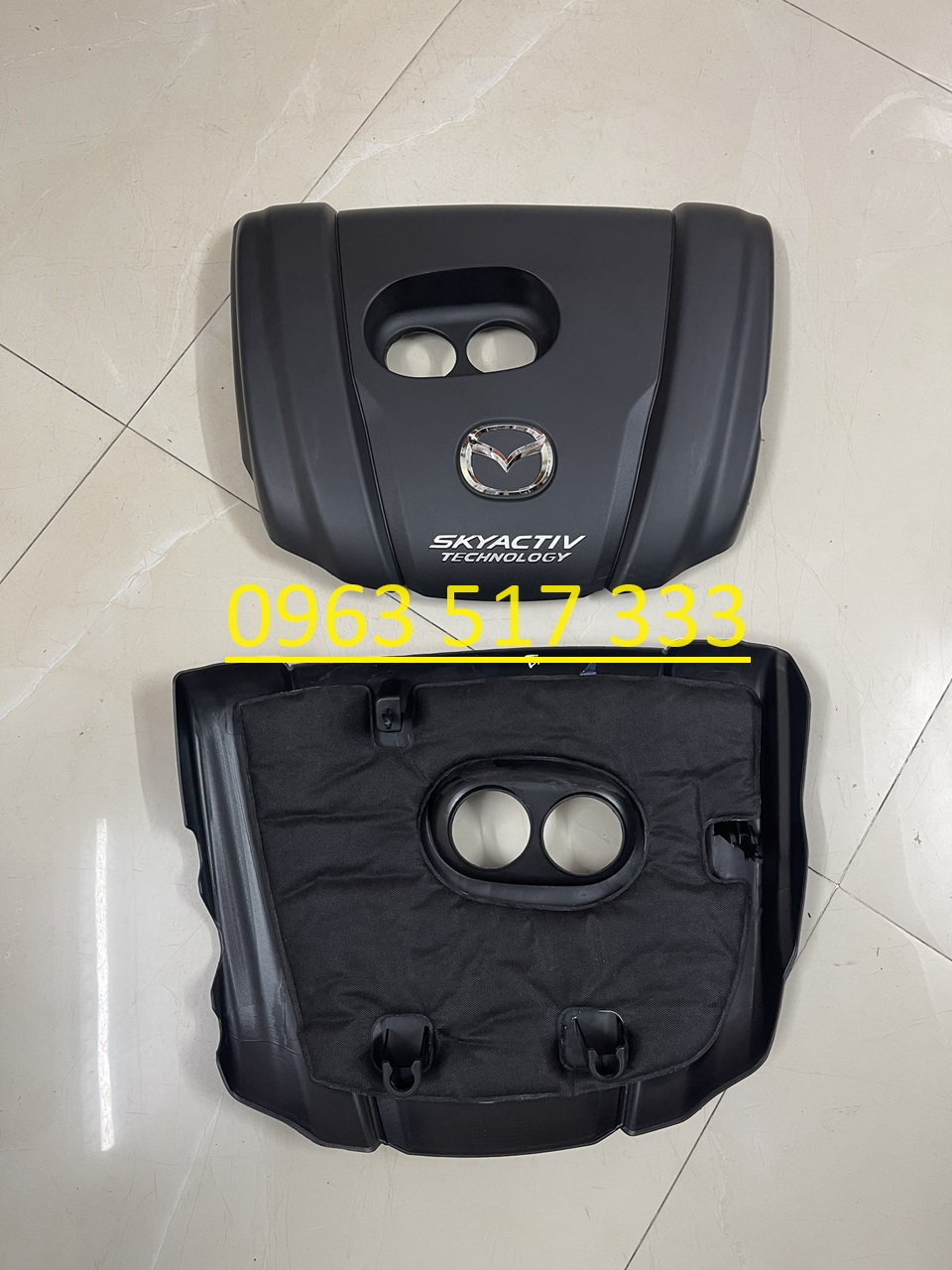 Nắp trang trí mặt máy Mazda 2